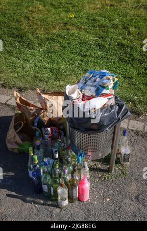overfilled dustbin in a park, Germany Stock Photo - Alamy