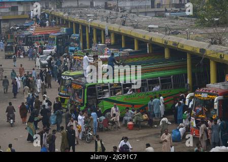 Pakistani people boarding roof top on a crowded bus as they travel to ...