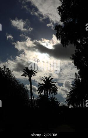 backlight blue sky with dark clouds Stock Photo - Alamy