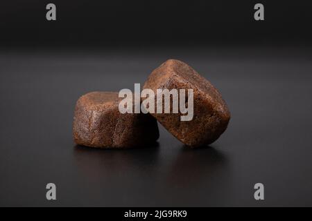 brown lumps of cannabis Moroccan hashish with high thc on a black ...