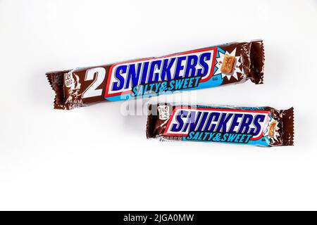 Two Snickers bar with crunchy peanut butter and nougat covered in milk ...