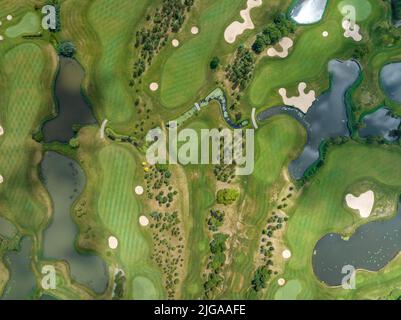 Golf Field Background. Aerial view of green grass and trees on a golf ...