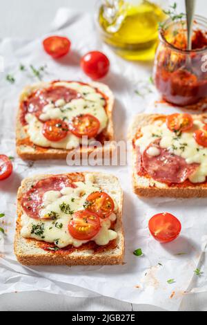 Homemade and tasty toasts as a quick snack for lunch. Toasts made with ...