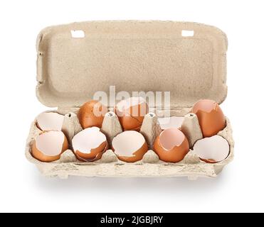 Cardboard holder with broken egg shells isolated on white background ...