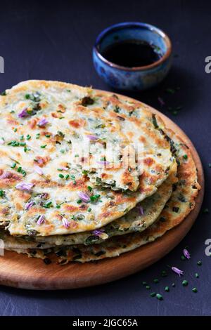 Homemade appetizing scallion pancakes served with soy sauce Stock Photo ...