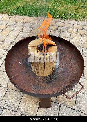 Swedish torch burning in a fire bowl Stock Photo - Alamy