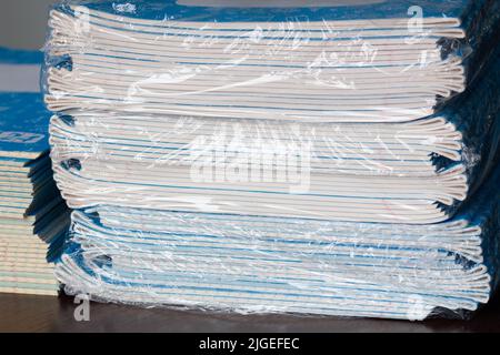 Stack of Notebooks. Back to school. A pack of blue school notebooks on ...