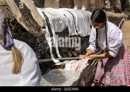 Chirche, Tenerife, 10 July 2022. Young girls washing clothes in a ...