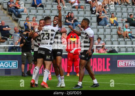 Connor Wynne #23 of Hull FC gets away from Ben Davies #22 of St Helens ...
