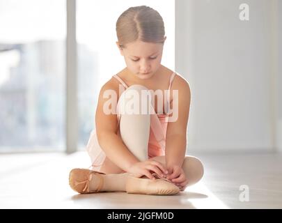 The art of ballet chooses the dancer. a little girl practicing ballet ...