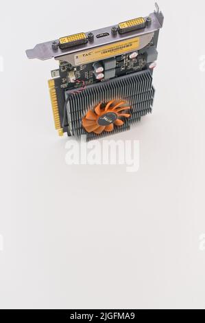 consumer video graphic card with pci express connector on a white desk ...