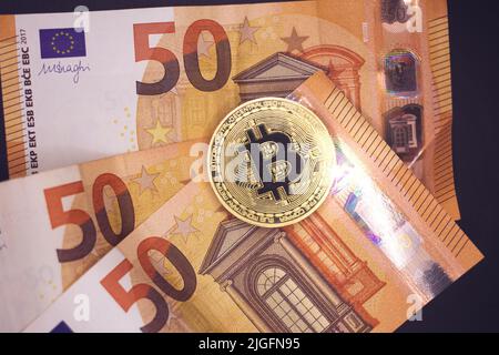 Bitcoin with 50 euro banknotes concept of crypto currency Stock Photo ...