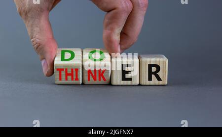 Doer or thinker symbol. Concept words Doer or thinker on wooden cubes ...