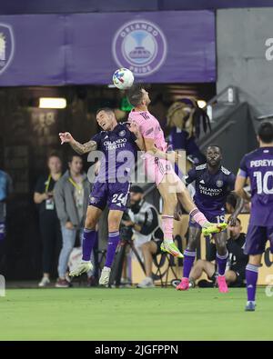 Orlando City defender Kyle Smith, right, defender Alex Freeman, center ...