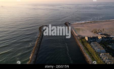 The New Jersey shore at Manasquan Inlet. The ocean is rough as there is ...