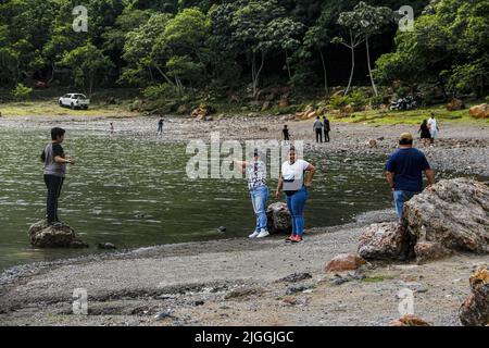 Tourists enjoy the Alegría Lagoon in the Tecapa Volcano. (Photo by ...