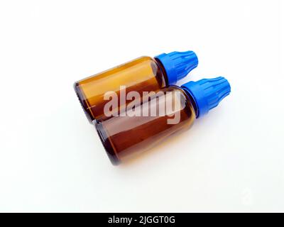 medicine glass brown and blue bottle isolated on white background Stock ...