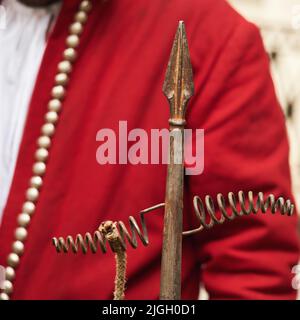A male gunner in a vintage Swedish military uniform with a ramrod in ...