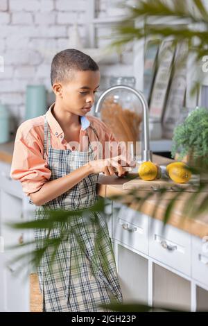 Happy afro family preparing dough together in kitchen Stock Photo - Alamy