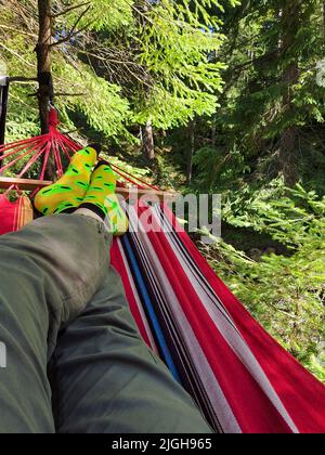 green leaf laying down on the ground with water pooling on it Stock ...