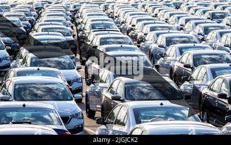The concept of a decline in car production or prices. Manufacturing ...