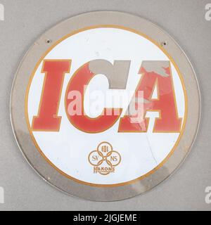 blue glass plate with holes in and light shining through it from above ...