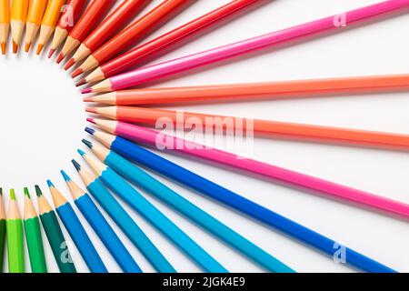 Central composition of colorful crayons on white surface Stock Photo ...