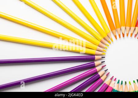Central composition of colorful crayons on white surface Stock Photo ...