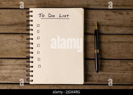Image of notebook with to do list and copy space on wooden surface with ...