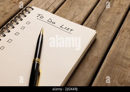 Image of notebook with to do list and copy space on wooden surface with ...