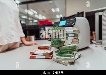 Sorted banknotes placed on the table after it is counted on the ...