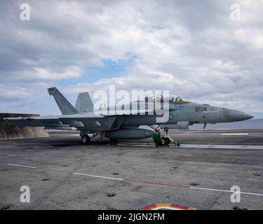 U.S. Air Force Maj. George Kotti, standing, with the 81st Medical ...