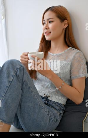 Portrait, Charming millennial Asian woman or female freelancer working ...