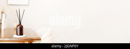 Reed diffuser on table in room Stock Photo - Alamy