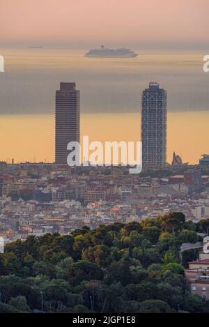 Sunrise in Barcelona, the Olympic towers and Sagrada Familia seen from ...