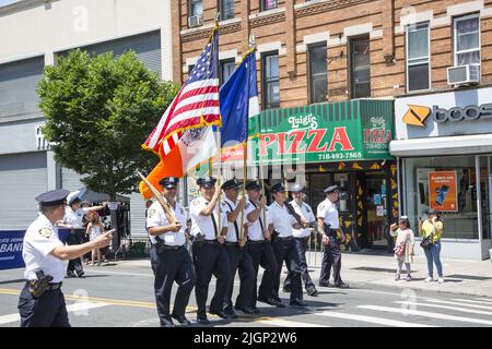 NYPD officers and marching band march in an American Independence Day ...