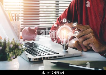 Businessman holding a light bulb, social media concept Stock Photo - Alamy
