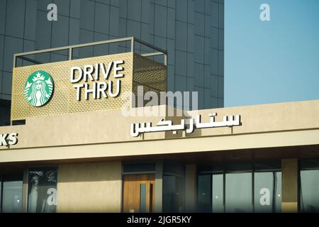 Arabic Starbuck drive-thru sign, Starbucks sign downtown. Saudi Arabia ...