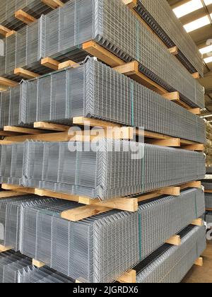 A stack of profile style welded mesh fencing panels, uncoated ...