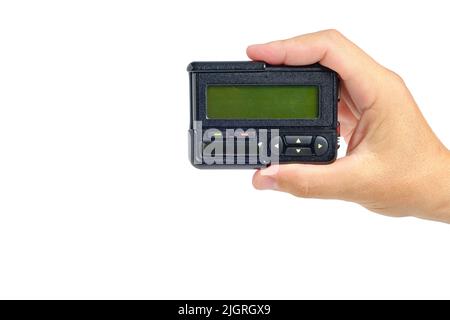 Old pager device with hand isolated on white background Stock Photo - Alamy
