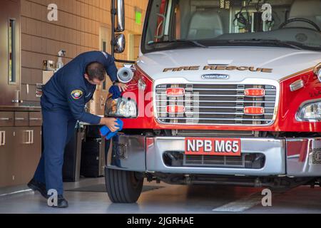 A fire engine gets a cleaning and polishing at a firehouse in Newport ...