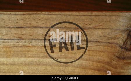 Fail stamp printed on wooden box. Failure, bankrupt and failed business ...