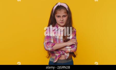 Dislike. Upset young preteen child girl kid showing thumbs down sign ...