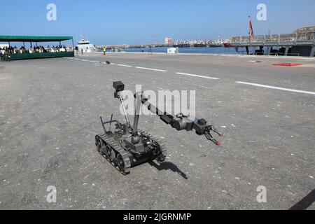 U.S. Marine recovery robot returns to safety after recovering a ...