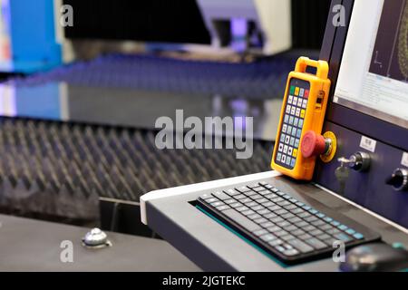 Operator console of CNC laser cutting machine. Selective focus Stock ...