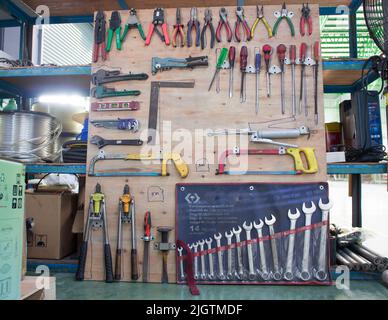 Home maintenance - An untidy workbench full of dusty old tools and ...