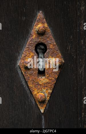 Keyhole on a wooden door Stock Photo - Alamy