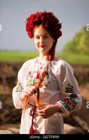 Unbreakable Ukraine. Portrait of a red-haired Ukrainian woman in an ...
