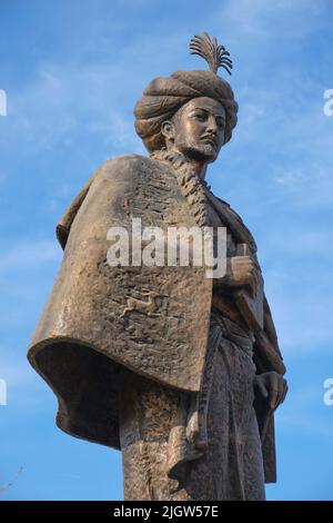 A bronze statue of a standing Bobur, famous leader and who started the ...