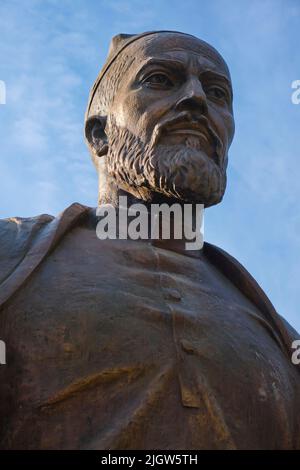 A bronze statue of a sitting Muqimiy, famous writer and critic. At ...